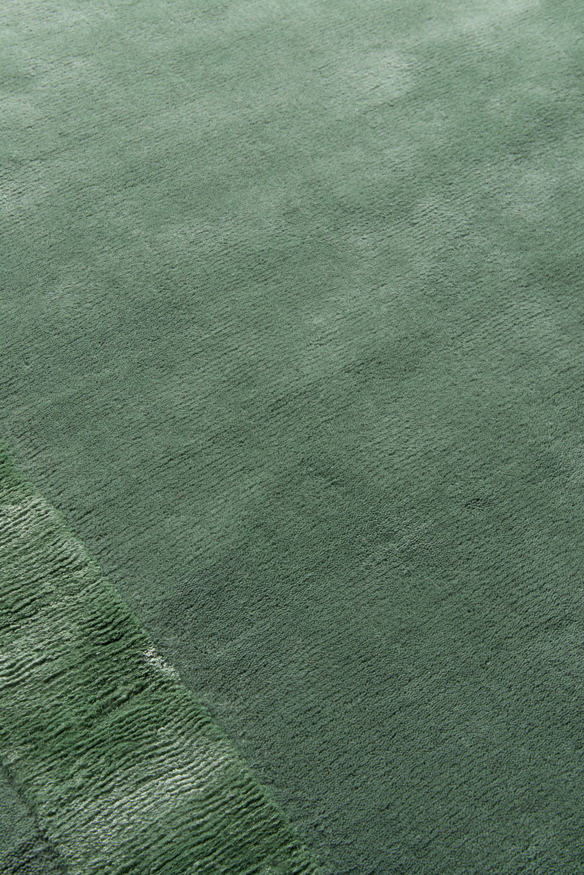 Silk Border Kent Green Handloomed rug by Farrow & Ball