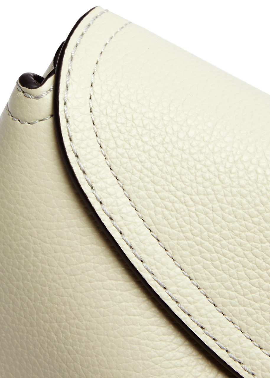 TOTEME T-Lock leather clutch | Harvey Nichols