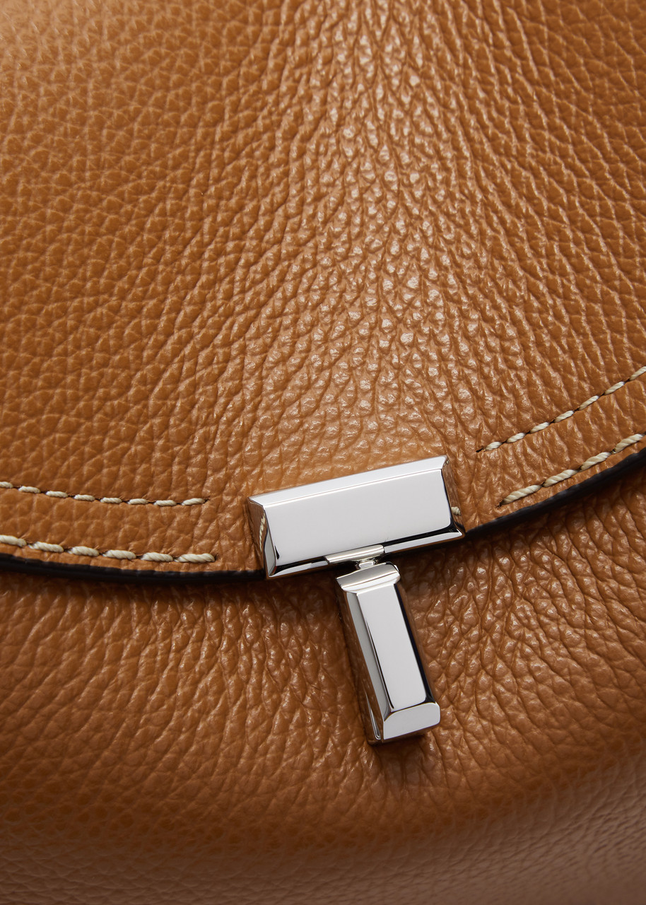 TOTEME T-Lock leather clutch | Harvey Nichols