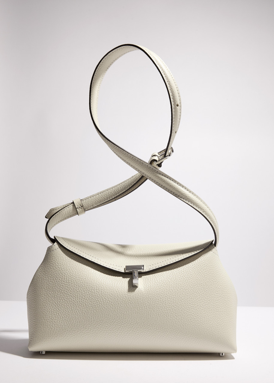 TOTEME T-Lock leather clutch | Harvey Nichols