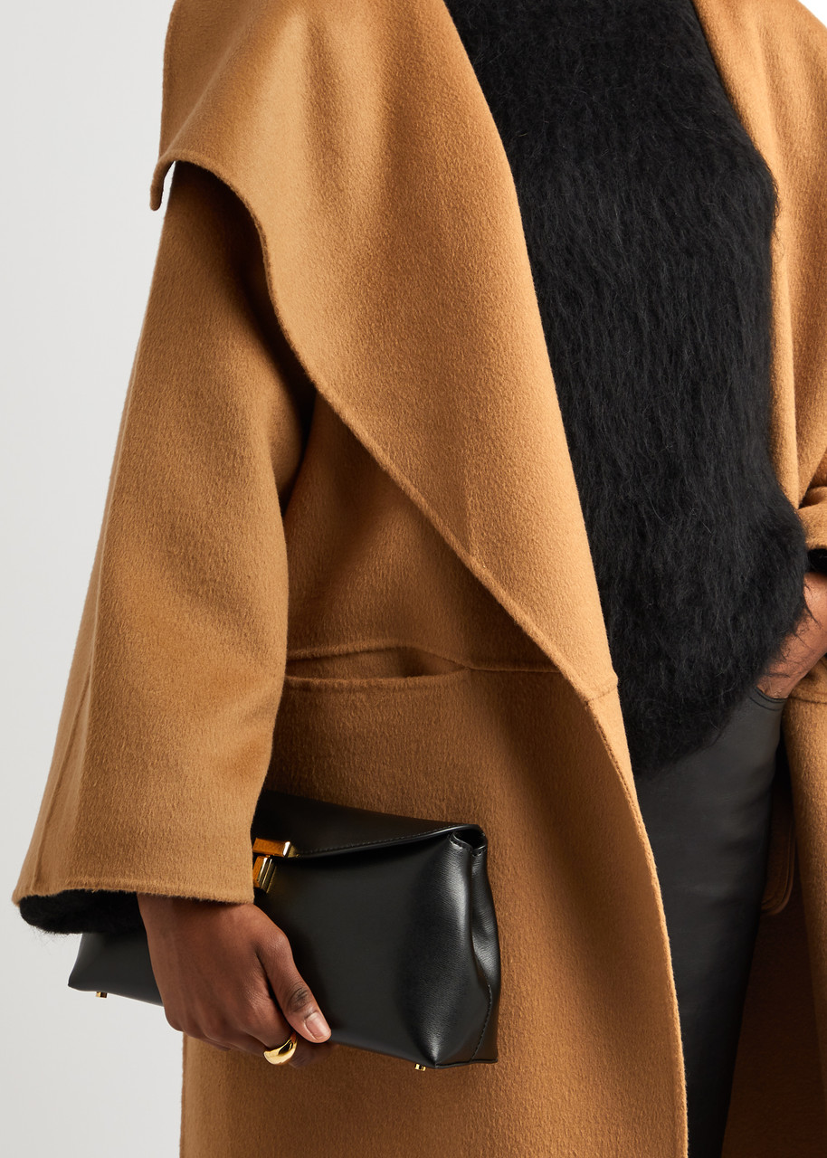 TOTEME T-Lock leather clutch | Harvey Nichols