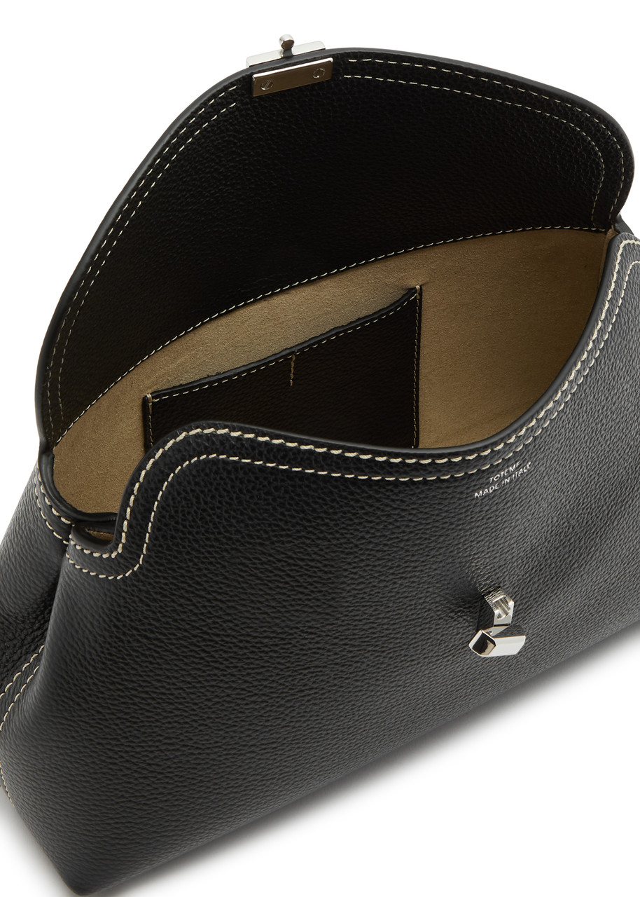 TOTEME T-Lock leather clutch | Harvey Nichols