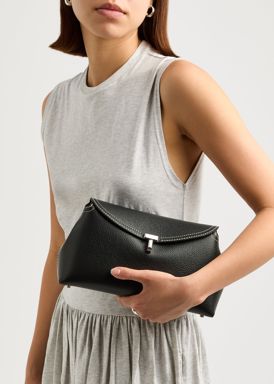 TOTEME T-Lock leather clutch | Harvey Nichols