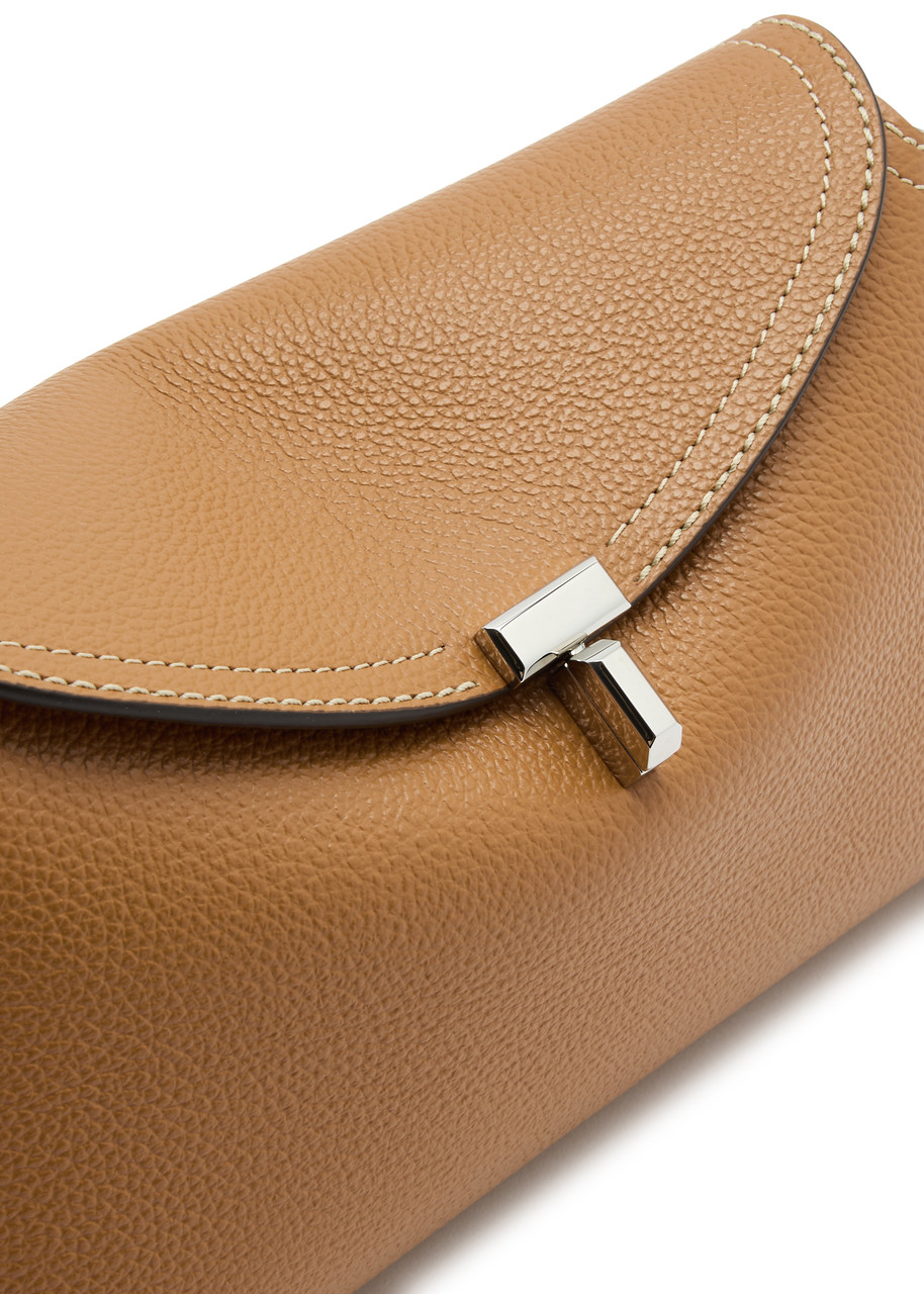 TOTEME T-Lock leather clutch | Harvey Nichols