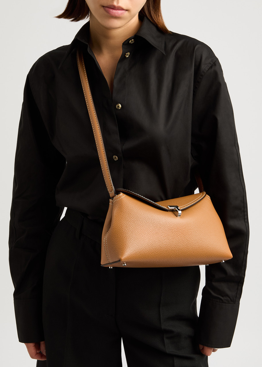 TOTEME T-Lock leather clutch | Harvey Nichols