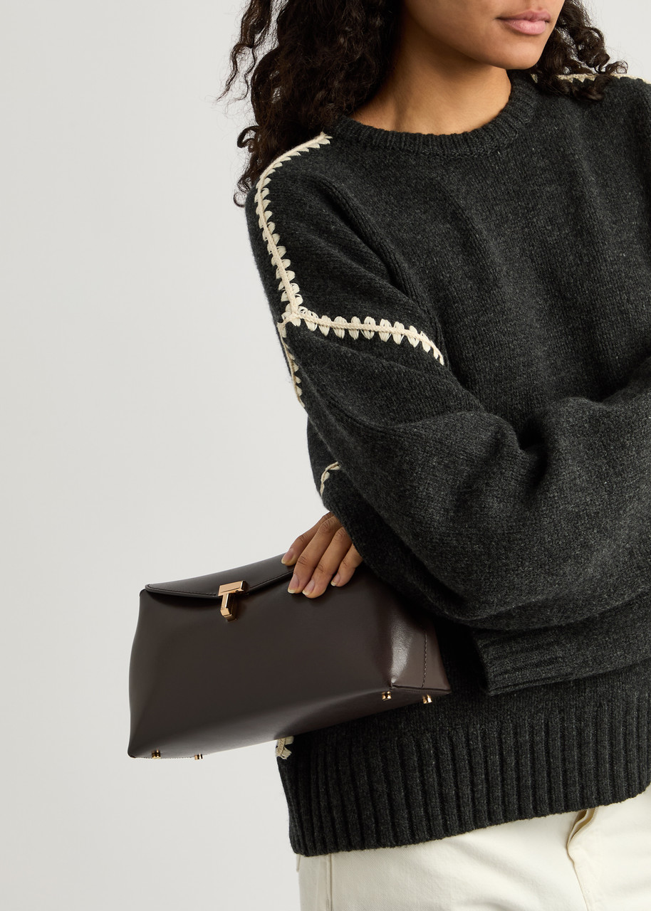 TOTEME T-Lock leather clutch | Harvey Nichols