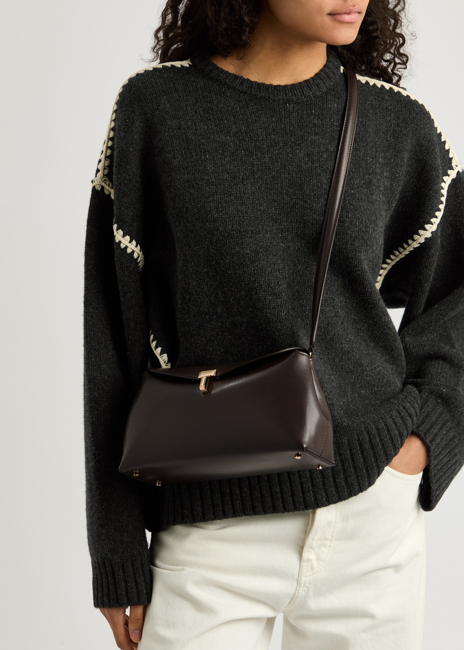 TOTEME T-Lock leather clutch | Harvey Nichols