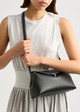 TOTEME T-Lock leather clutch | Harvey Nichols