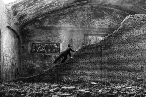 Laminated Well Dressed Man Climbing Crumbling Wall B&W Photo Photograph ...