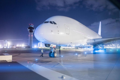 Engineer Communicating with Pilot Airbus A380 on Runway at Night Photo ...