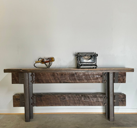 Uniquely worn side table from reclaimed steel wood