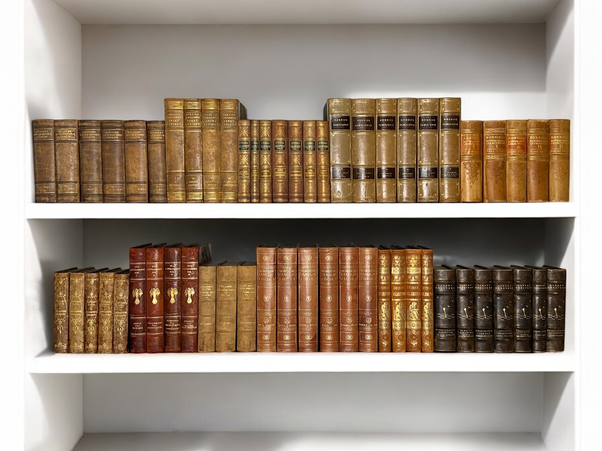 Sets of leather-bound books.