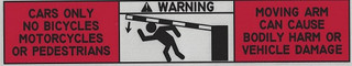 Automated vehicle gates warning labels. Warning labels.