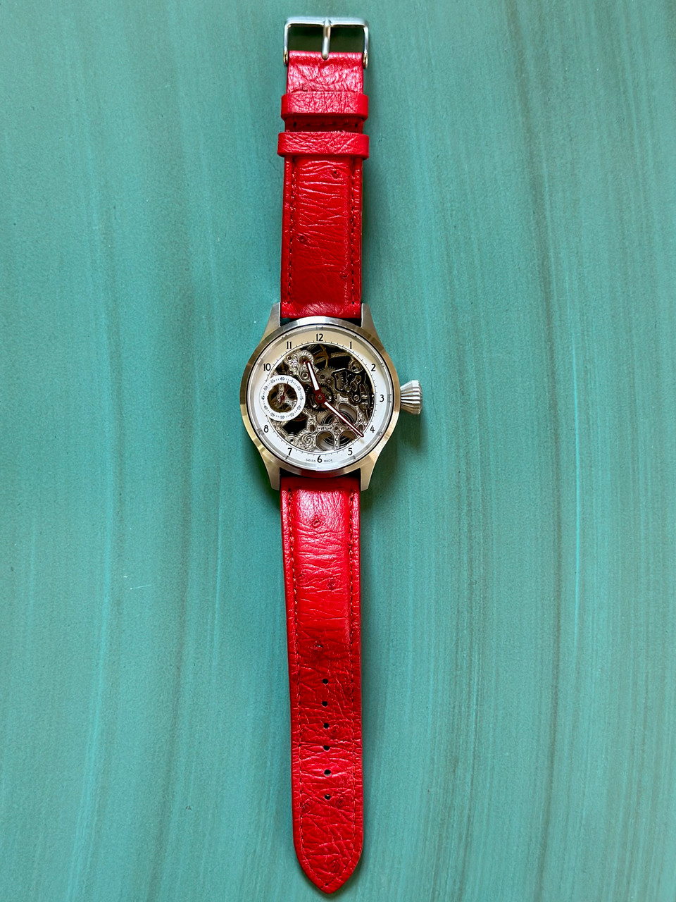 White Skeleton watch with red hands