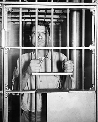 Posterazzi Portrait of a mid Adult Man Standing Behind Prison Bars ...