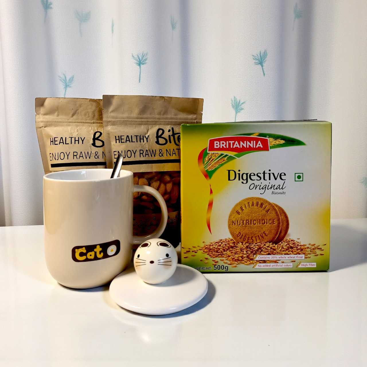 Cozy Sips & Crunchy Bites: Cat Mug with Nuts & Biscuits