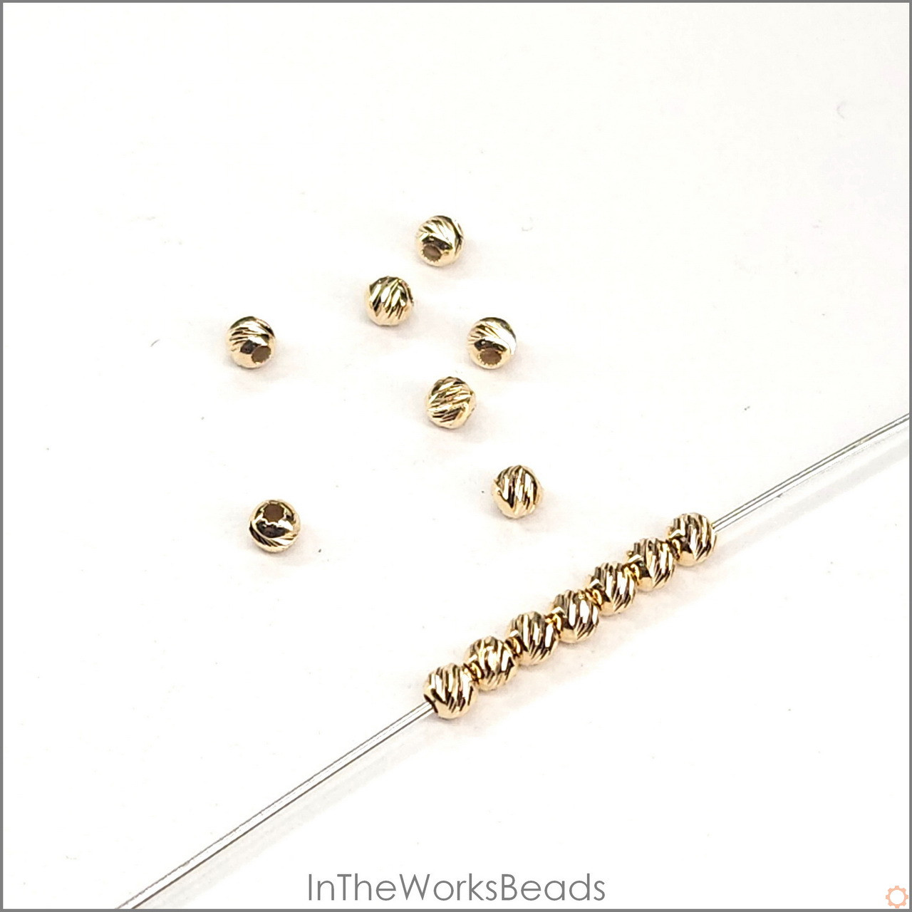 14k Gold Diamond Cut Bead 2mm. 0.8mm Hole - InTheWorksBeads