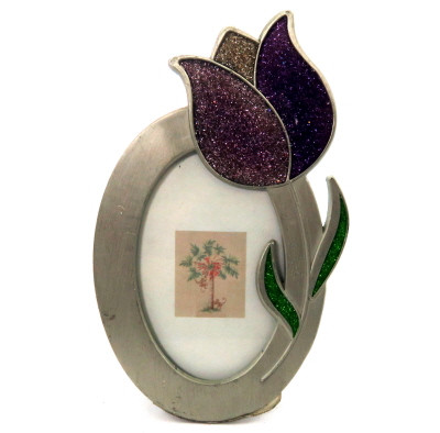 Small oval shaped picture frame with a large tulip along the right side ...