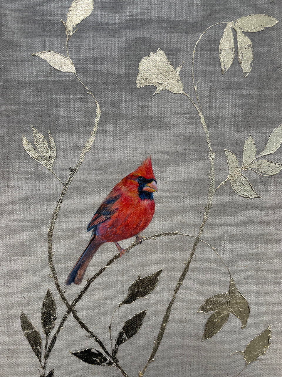 Red Cardinal on Ornamental Gold Leaf Roses