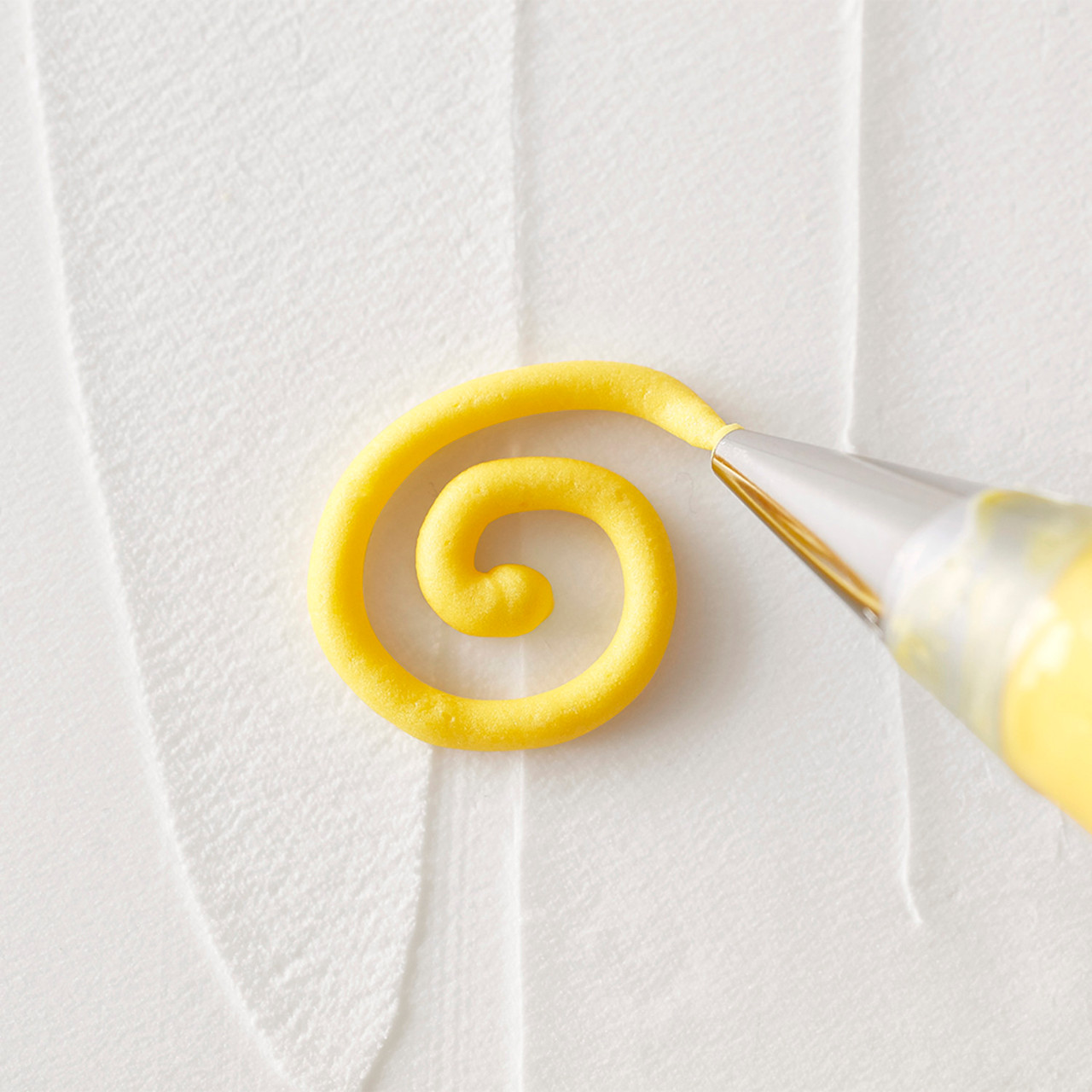 How to Pipe Swirl Drop Flowers - Wilton