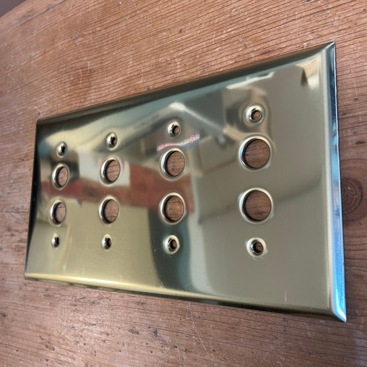 4 Gang Pushbutton Switch Plate in Polished Brass