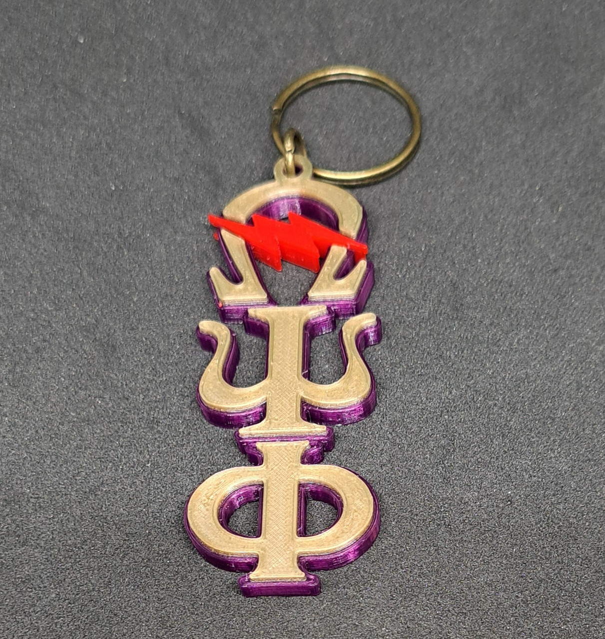 Omega Psi Phi - Keychain with Red Lightning Bolt