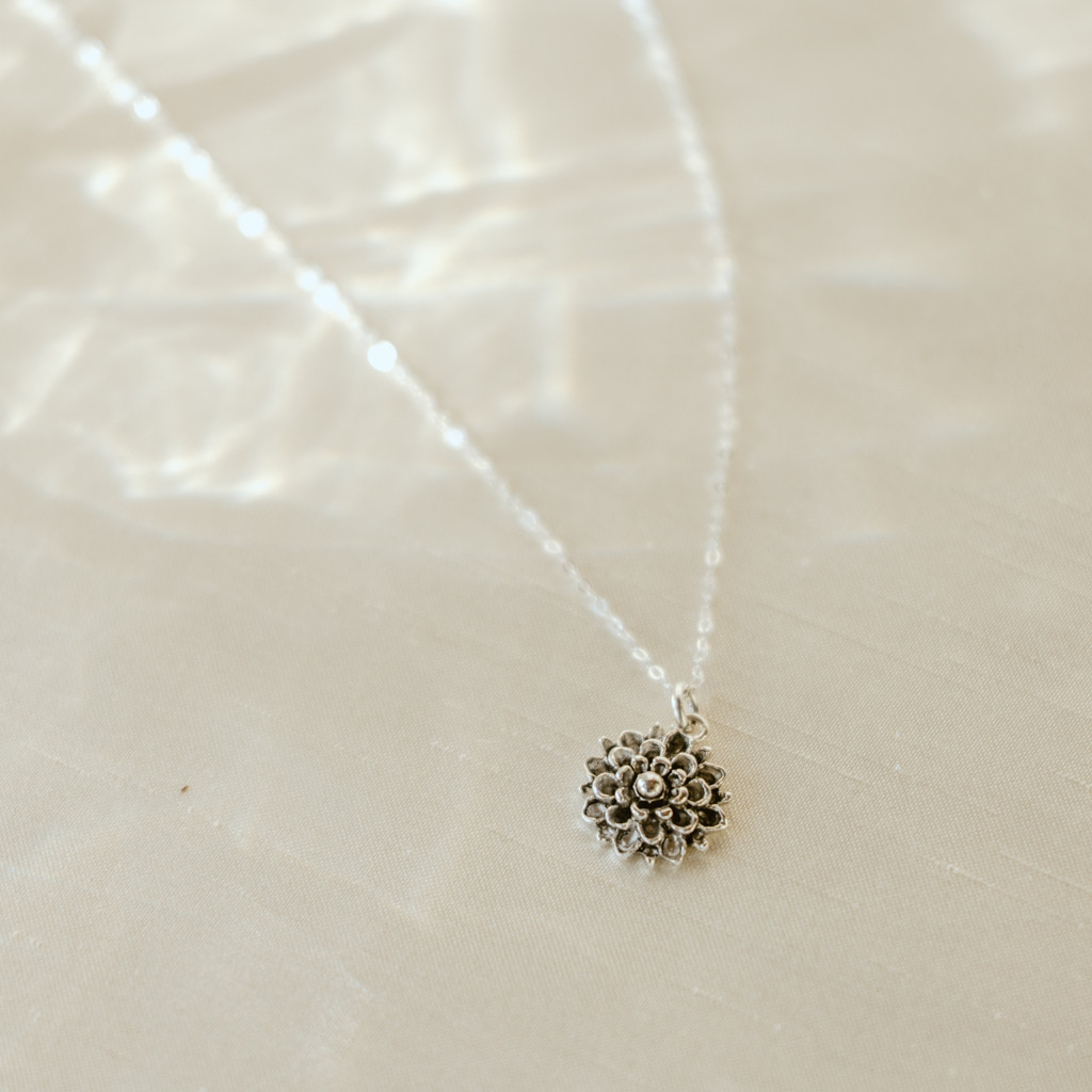 Mandy flower locket shaped like a chrysanthemum with a hidden photo on ...