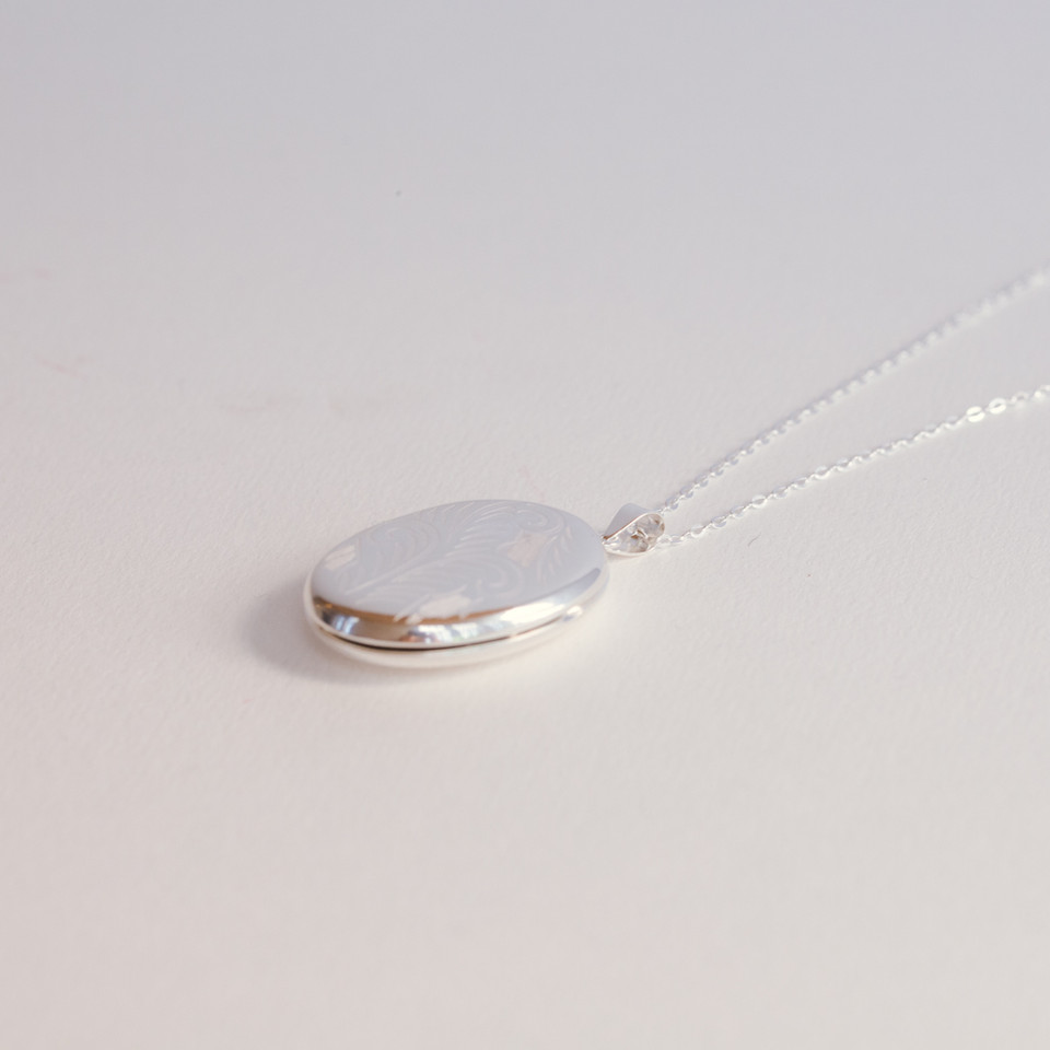 Oval Sterling Silver Locket with etching holds 2 photos inside ...