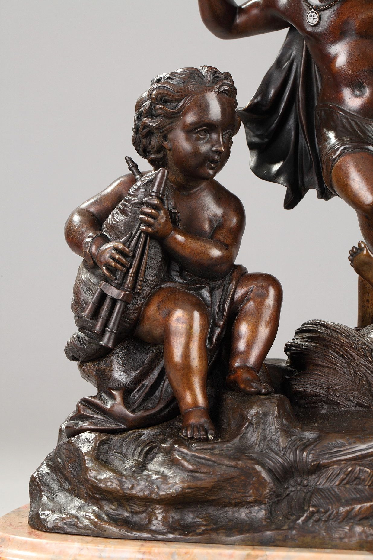 MUSICIAN-PUTTI IN BRONZE PATINA AND MARBLE, 19TH CENTURY
