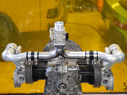 Single throttle body intake package with turbo plenums