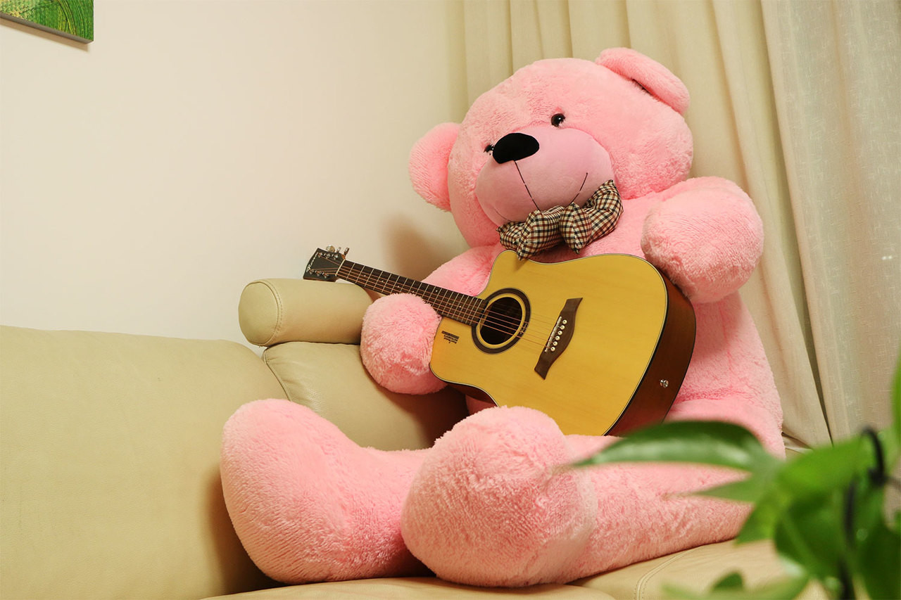 Retro Teddy Bear Toy With Hairstyle Playing Bass Guitar And Sitting On ...