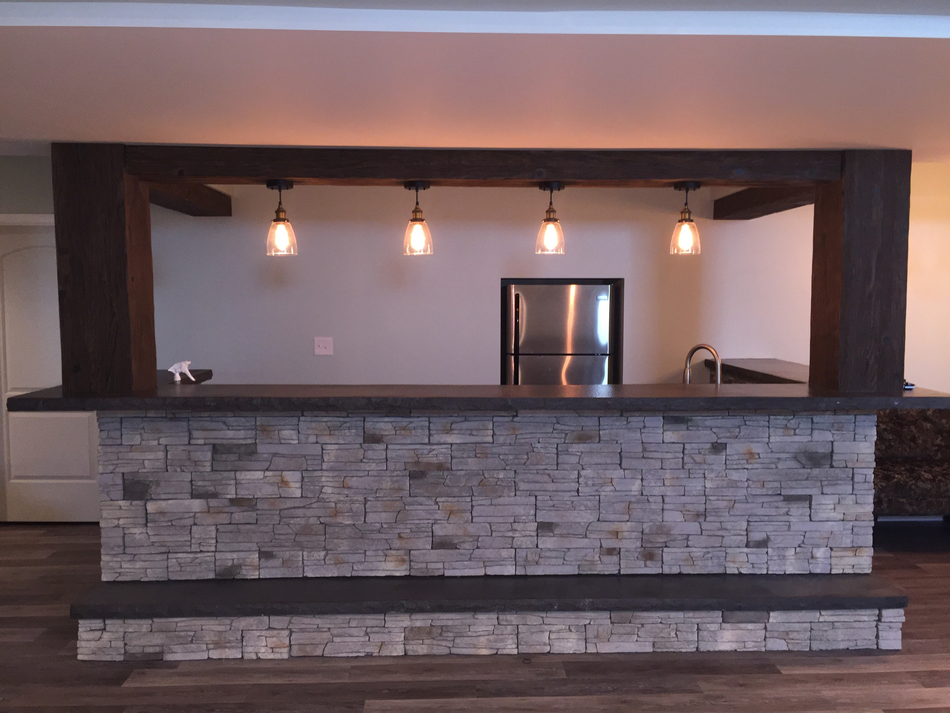 Incredible Basement Bar Design with Beams - Barron Designs