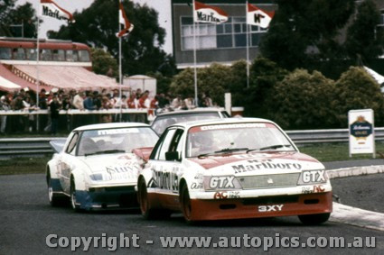 83014 - Peter Brock - Holden Commodore VH / Allan Moffat - Mazda RX7 ...