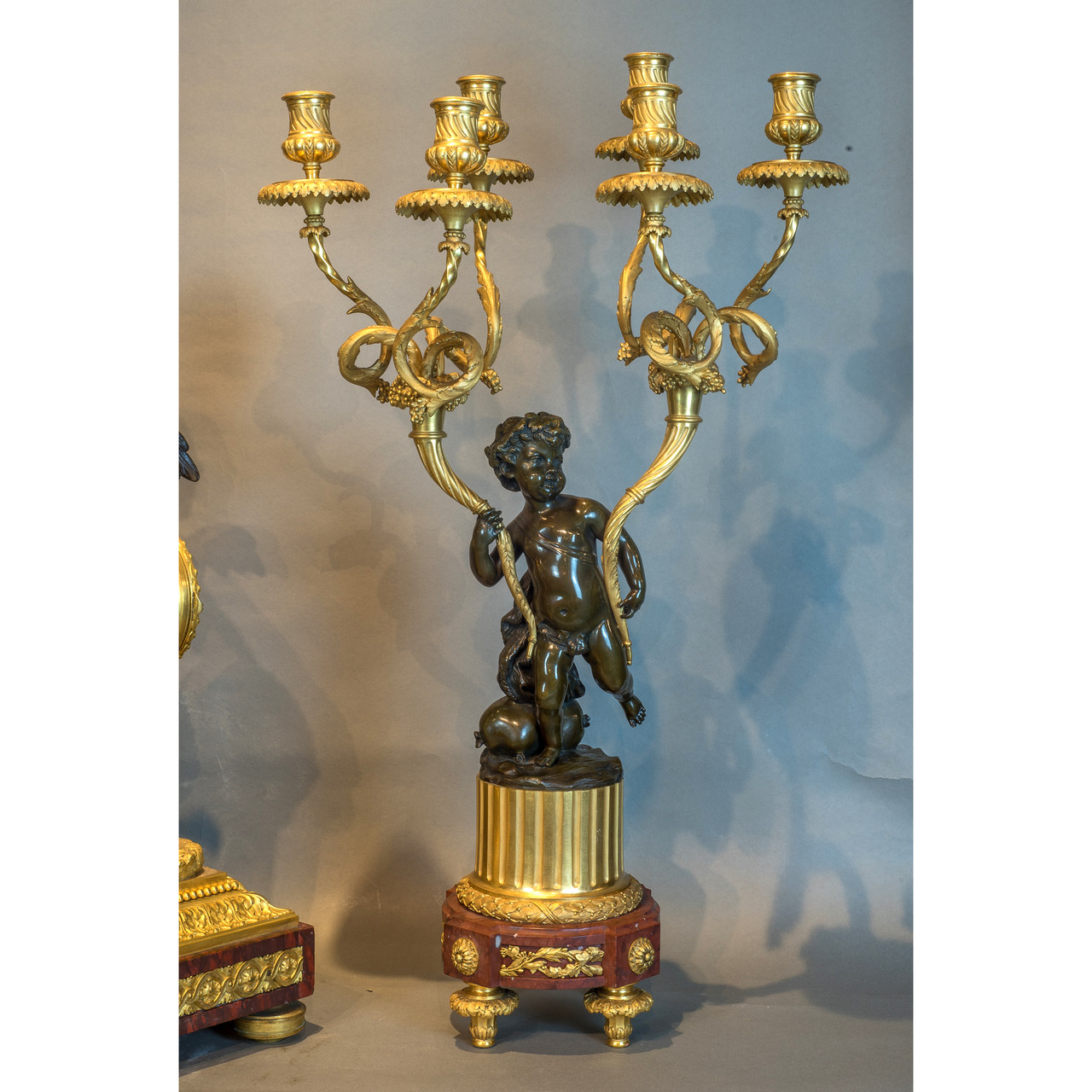Antique French Patinated and Gilt Bronze Clock Set Garniture with Putto