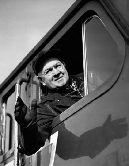 Train conductor leaning out of engine window Poster Print - Item ...