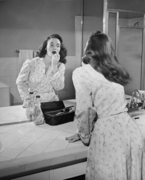Applying Lipstick In Mirror