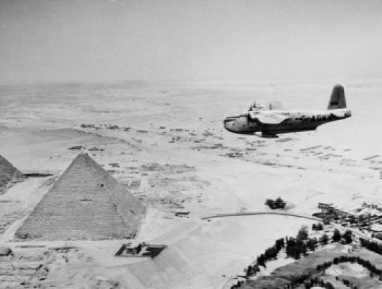 Egypt Giza Aeroplane flying over Giza Pyramids Poster Print - Item ...