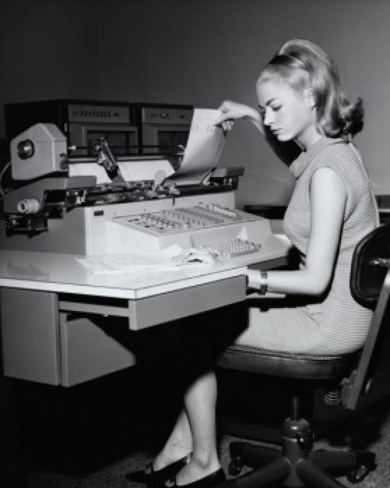 Side profile of a technician working in a computer lab NCR 500 Poster ...