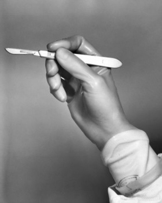 Surgeon's hand holding a scalpel Poster Print (8 x 10) - Item ...