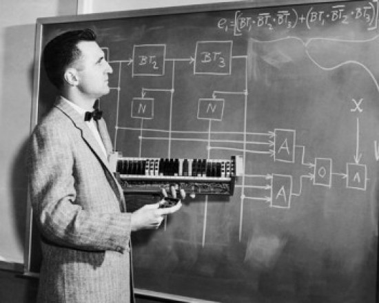 Electronic engineer holding building blocks and explaining logical ...