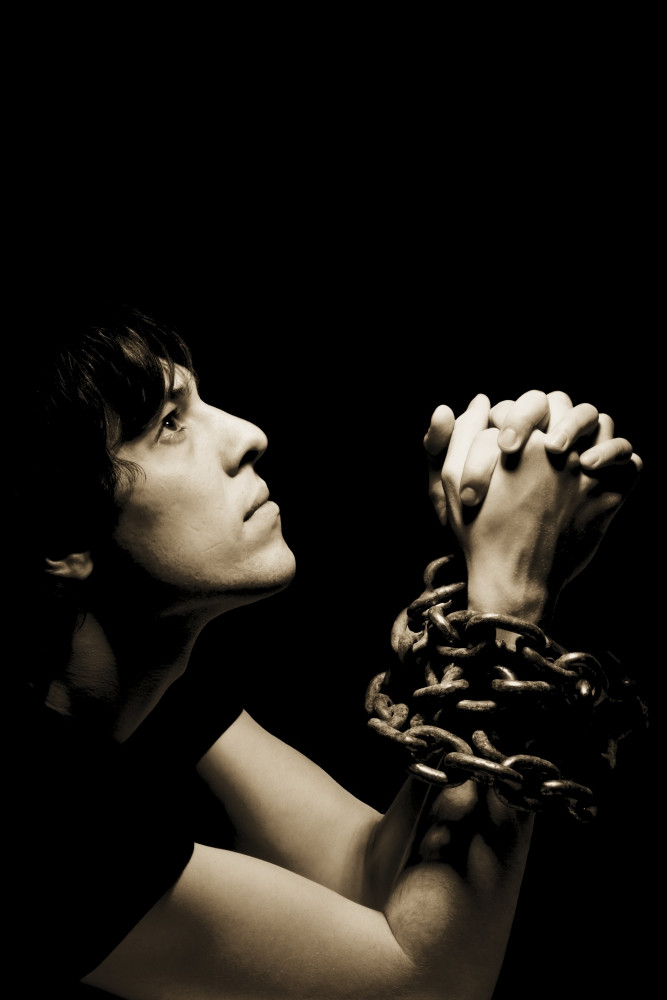 Man In Chains With Hands Clasped Poster Print by Chris and Kate Knorr ...