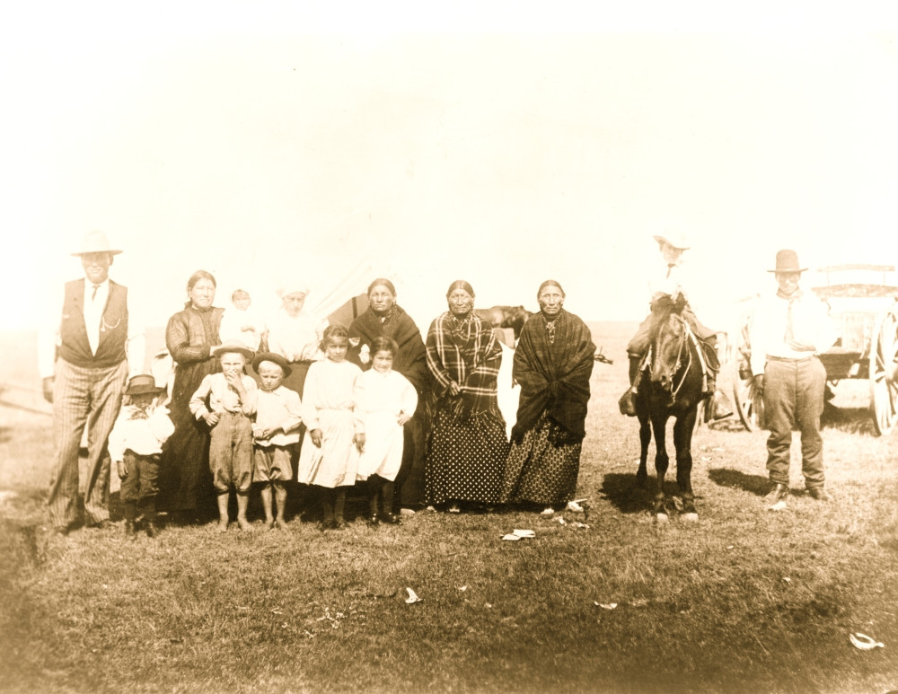 Group of Kickapoo Indians, standing outside tent, dressed in Euro ...