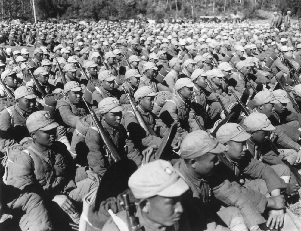 Chinese Soldiers Seated In Rows Equipped With Rifles And Fresh Uniforms ...