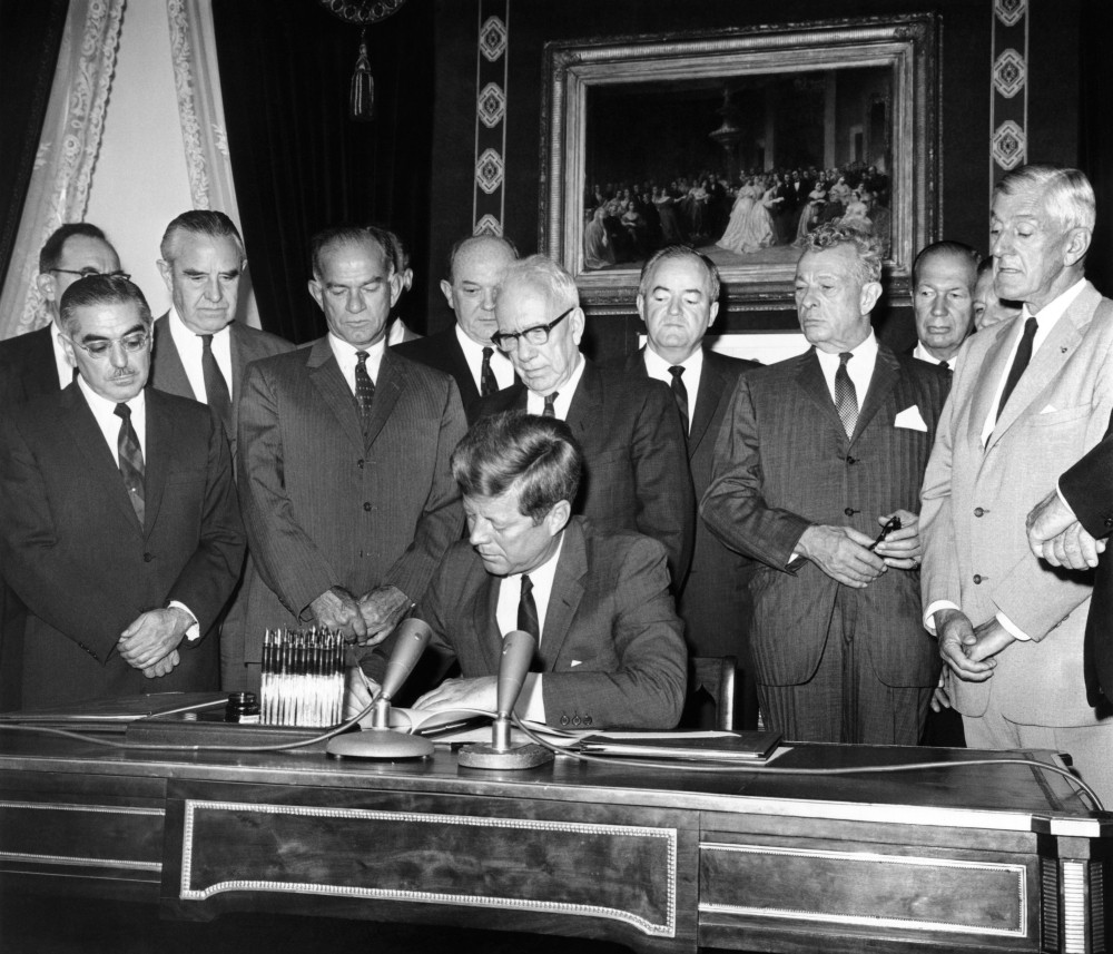 1963 Test Ban Treaty. President John Kennedy Signs The Document ...