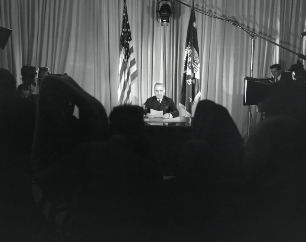 President Harry Truman Seated At His Desk With Lights On And Cameras ...