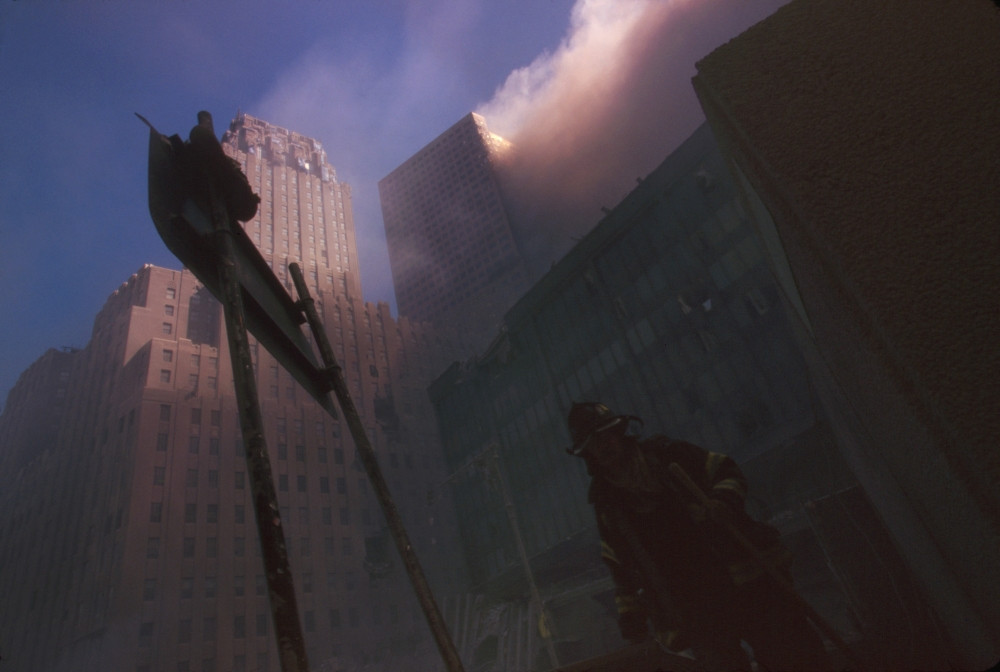 Fire Fighter At Base Of Burning Wtc 6 Following The North Tower ...