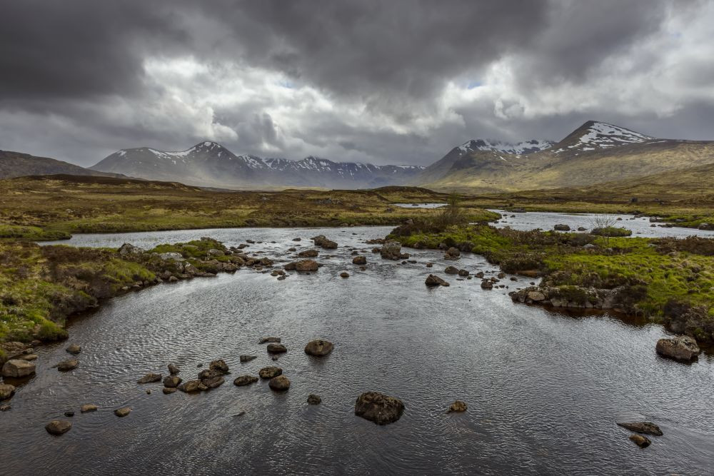 Moor landscape with river and storm clouds at Rannoch Moor in Scotland ...