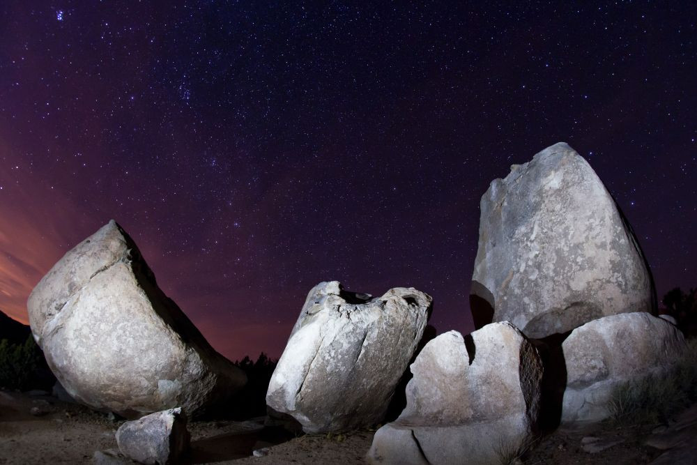 Big boulders and split rocks create mysterious shapes against the ...