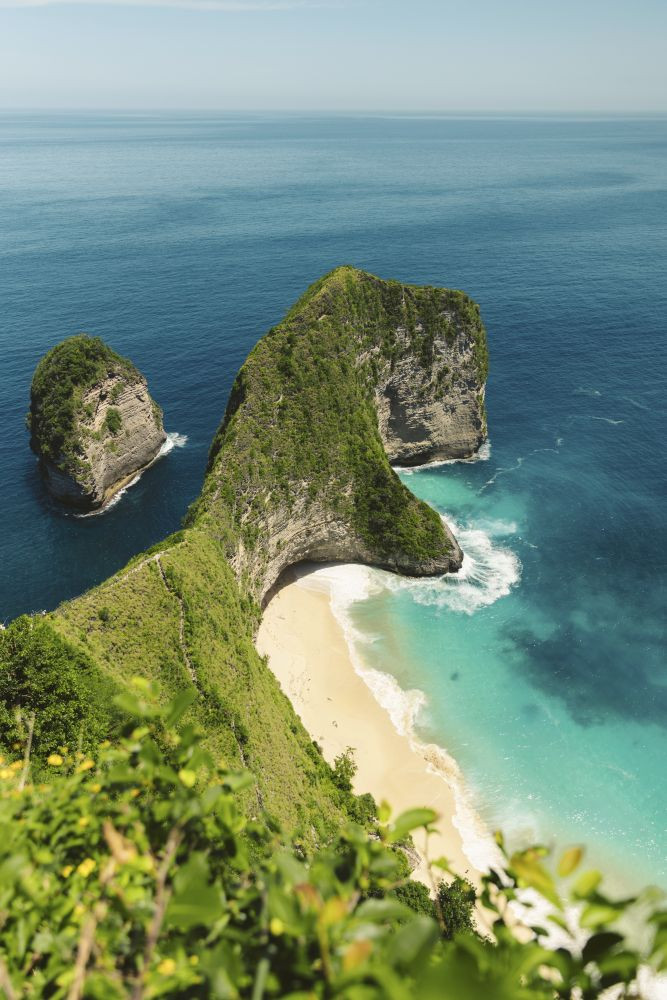 Sea stack and rock formation along coastline jutting out into the ocean ...