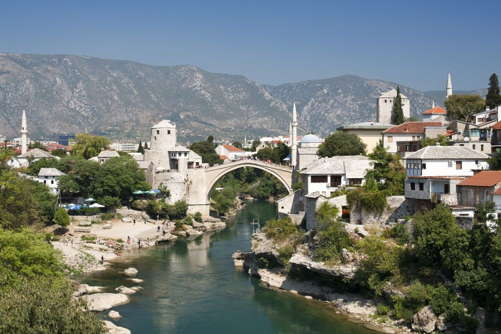 Mostar and the Stari Most Old Bridge spanning the Neretva River. Poster ...